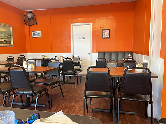 Classic diner seating where strangers become friends over shared appreciation for perfectly executed comfort food and genuine hospitality.