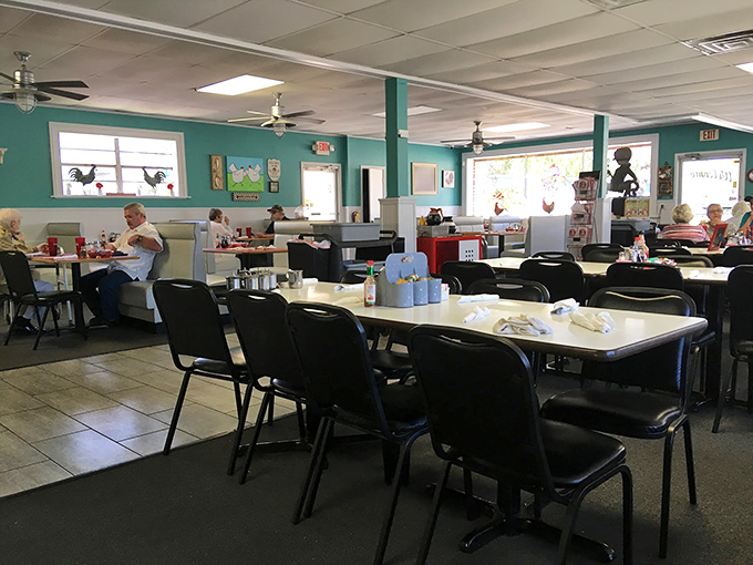 The dining area—where strangers become neighbors over eggs and toast. Those ceiling fans have witnessed countless "I remember when" conversations.