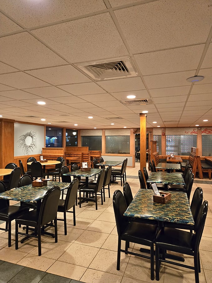 The dining room's no-nonsense approach says everything: we're here for serious seafood, not fancy frills. Those aquatic-themed tables have seen generations of happy diners.