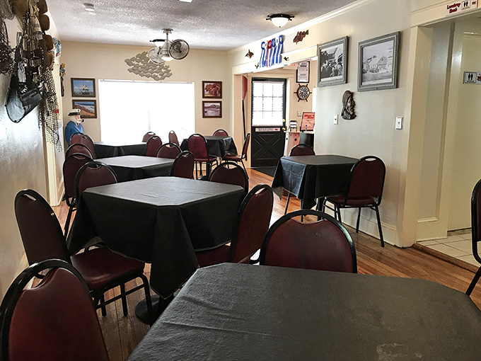 Simple tables draped in black cloths await seafood pilgrims, while nautical d&eacute;cor watches over like guardian angels of good taste.