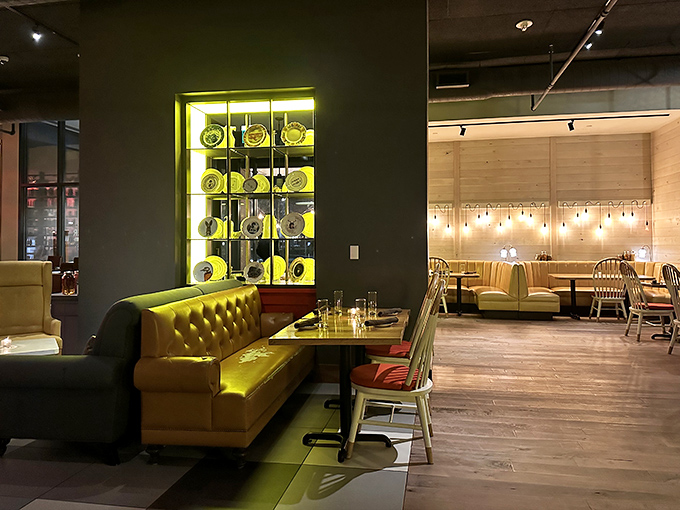 The dining area whispers "stay awhile" with its mustard banquettes and glowing display case&mdash;comfort wrapped in urban sophistication.