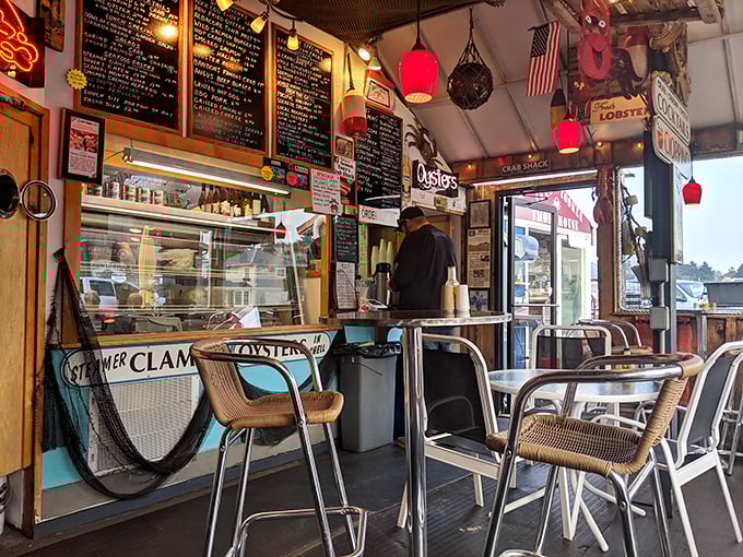 The casual dining area feels like the galley of a beloved fishing vessel, where every seat offers views of both menu and maritime charm.