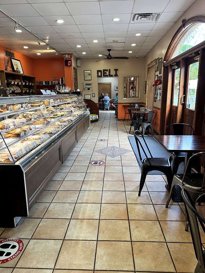 The deli's interior is where German efficiency meets Florida hospitality. Those display cases aren't just storing pastries—they're preserving happiness.