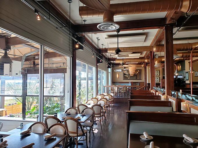 The dining area balances elegance with beachy ease&mdash;like your sophisticated aunt who still knows how to have fun at family gatherings.