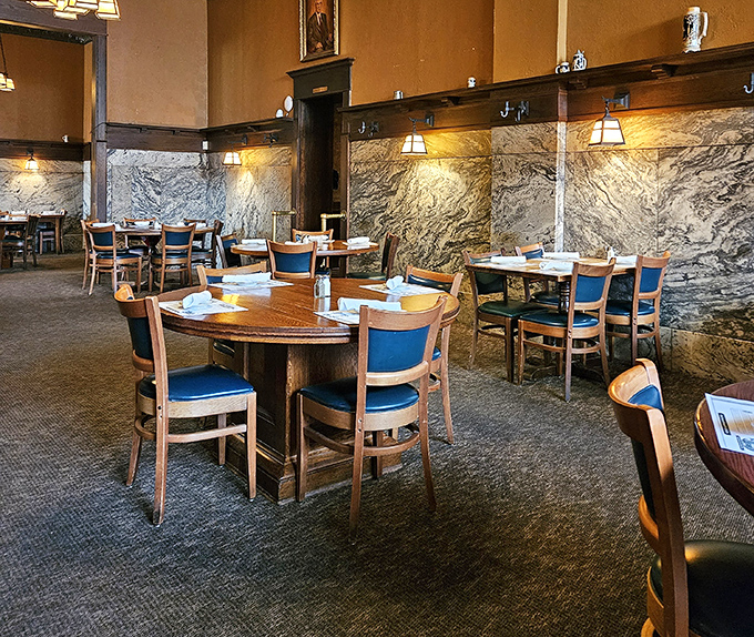 Marble walls and dark wood create dining rooms that feel like you've stepped into a secret club where the password is "excellent taste."