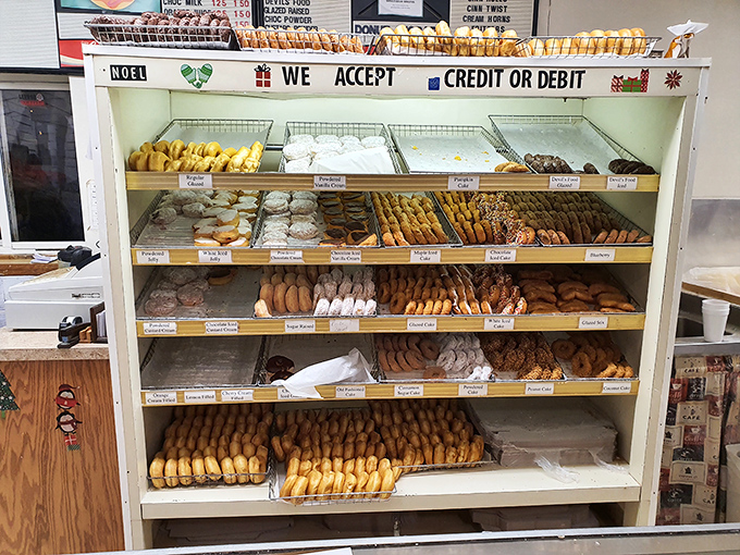 Fully stocked shelves are a beautiful sight at 7 AM. By 9 AM, this donut display will be significantly depleted by knowing locals.
