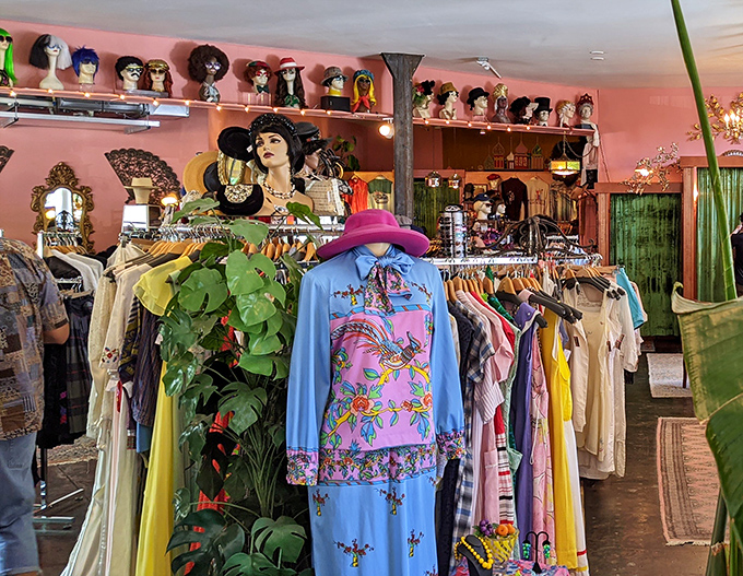 The colorful dress display creates a textile rainbow against Magpie's signature pink walls. Fashion this vibrant makes minimalism seem like giving up.