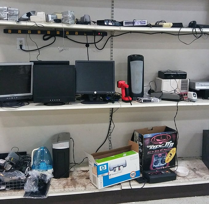 Computer monitors stand at attention like technological sentinels, waiting for someone to bring them back to digital life.