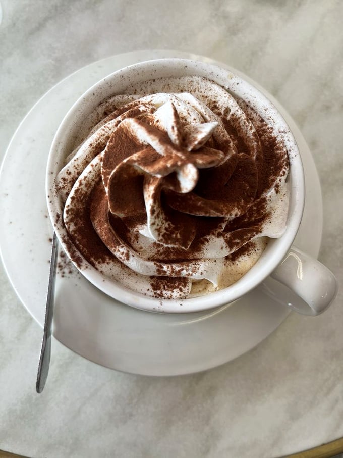 Coffee elevated to art form status. That foam swirl isn't just pretty&mdash;it's the barista whispering, "Today's going to be magnificent."