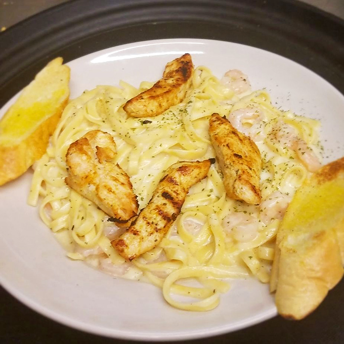 Pasta meets the ocean in this creamy fettuccine topped with perfectly grilled shrimp&mdash;carb heaven with a coastal upgrade.