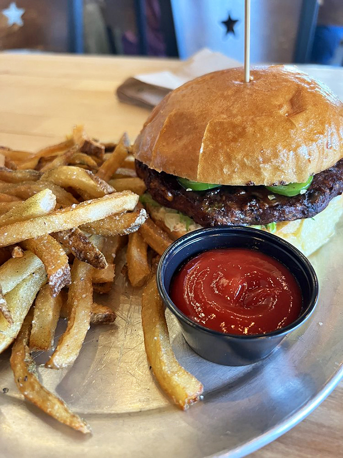 The Five Alarm burger doesn't just bring heat &ndash; it delivers a full sensory experience with cream cheese cooling the jalape&ntilde;o fire. Your taste buds will need therapy afterward.