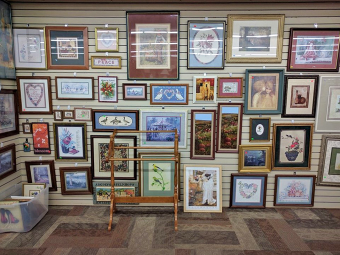 The wall of frames tells a thousand stories&mdash;none of them yours yet. From ornate gold to simple wood, they're just waiting for your family photos or vintage concert posters. 