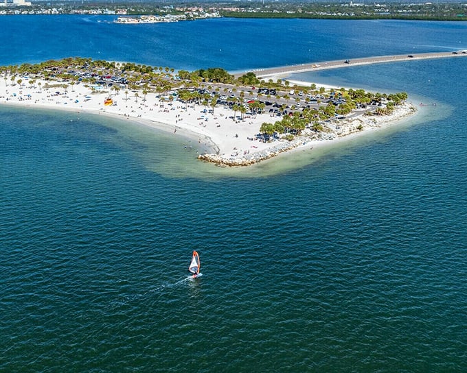 Fred Howard Park offers that perfect Florida moment&mdash;where azure waters meet pristine sand, and one lone windsurfer lives his best life.