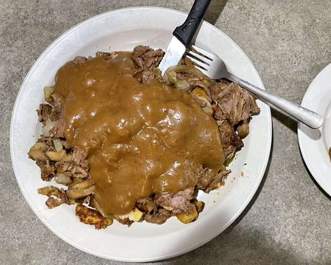 This pot roast has been swimming in gravy so long it's practically earned Olympic medals. Fork-tender doesn't begin to describe it.