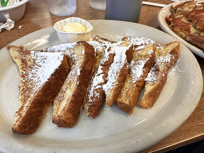 French toast golden enough to make Midas jealous, thick enough to satisfy any carb craving.