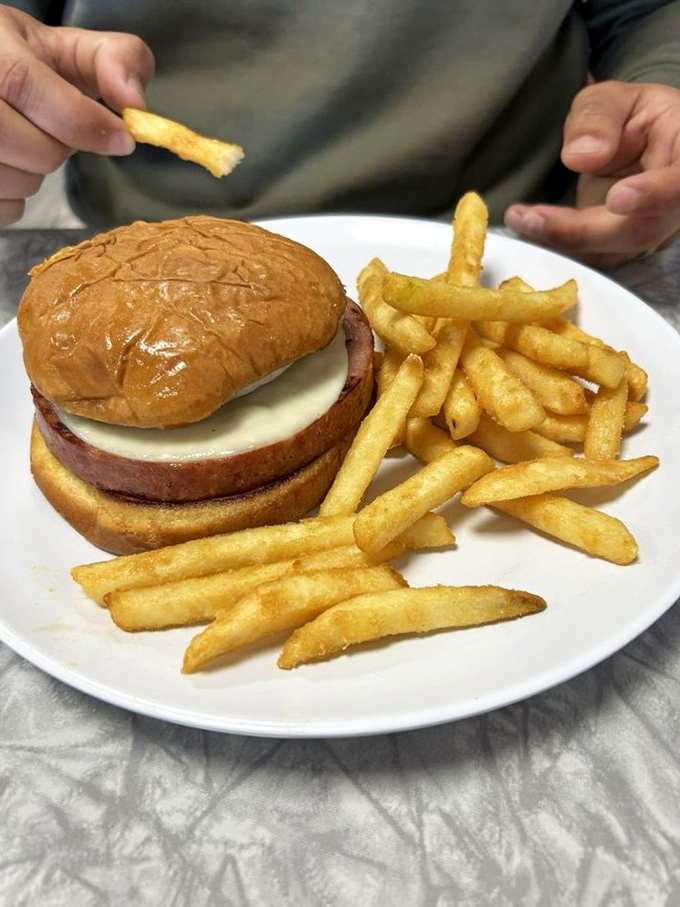 The humble burger elevated to art form. Those golden fries aren't just a side&mdash;they're essential supporting characters in this lunch drama.