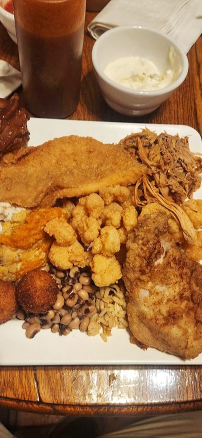 This isn't just a plate&mdash;it's a Southern symphony. The fried chicken alone would make Colonel Sanders rethink his life choices.