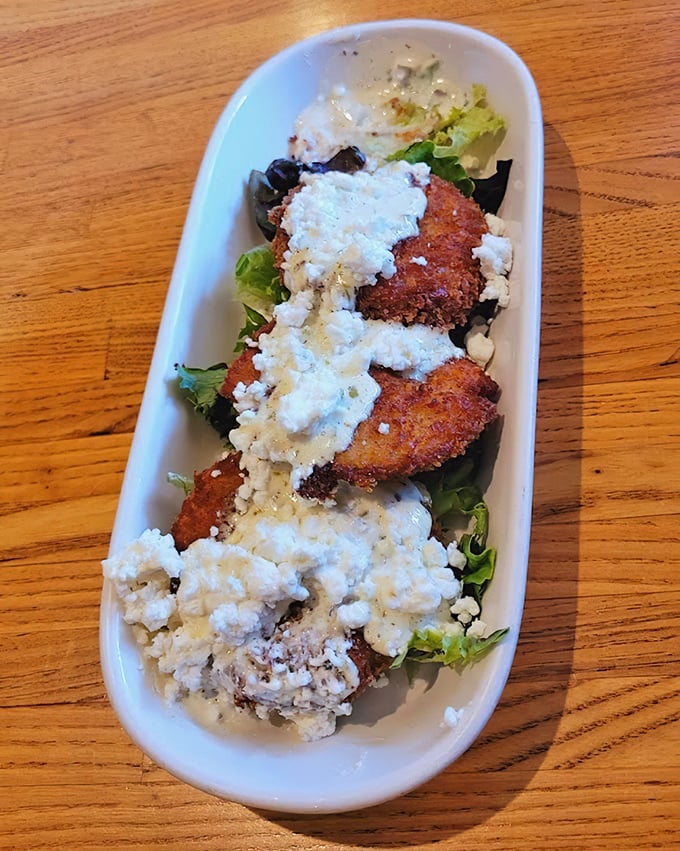 Fried green tomatoes topped with feta &ndash; Southern tradition meets Mediterranean flair in a dish that makes vegetable-skeptics reconsider their position.