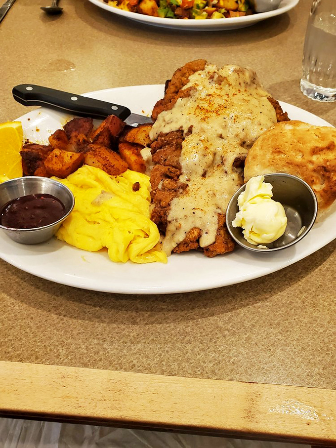 Country fried steak smothered in gravy with eggs sunny side up. Southern comfort meets Pacific Northwest execution.