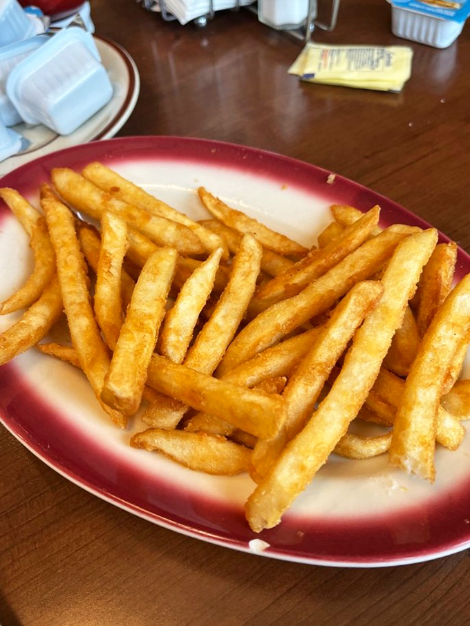 French fries that achieve the platonic ideal – crispy exterior, fluffy interior, and just the right amount of salt to make you reach for "just one more."