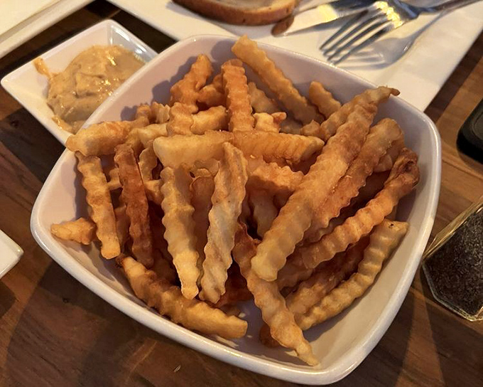 Crinkle-cut fries that walk the tightrope between crispy exterior and fluffy interior&mdash;the unsung heroes of any great tavern meal.