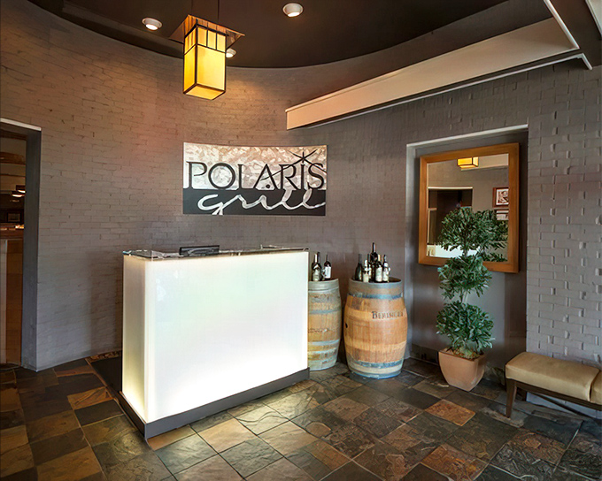 The welcoming front desk sets the tone for an evening where hospitality meets culinary excellence in perfect harmony.