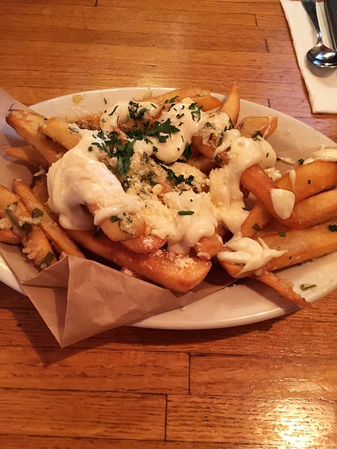 These aren't just fries&mdash;they're garlic-dusted, cheese-blessed potato vehicles for transferring joy directly to your soul.