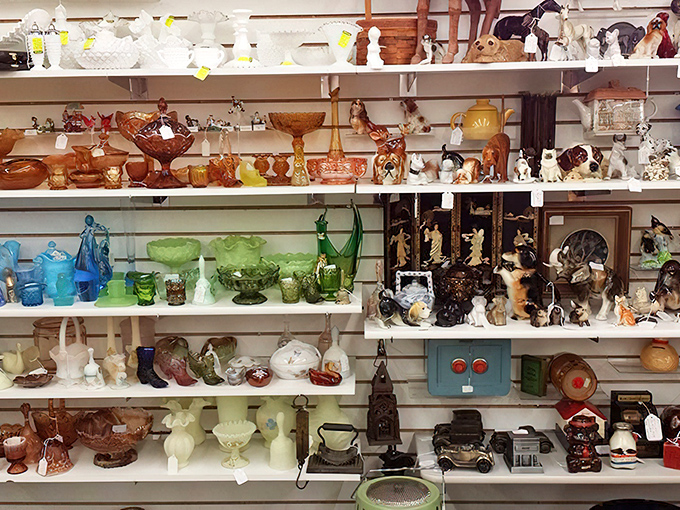 Shelves lined with collectible glassware and figurines&mdash;each piece silently competing to become your next "I couldn't leave without it" purchase.