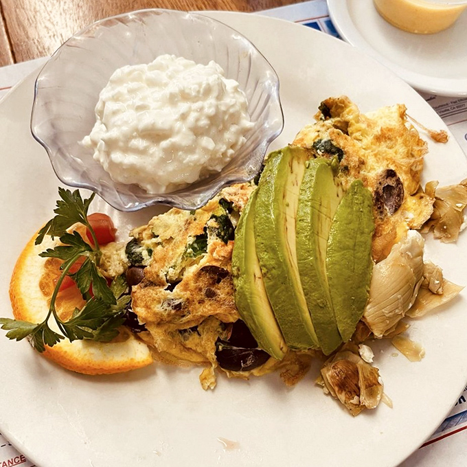 This isn't just an omelet&mdash;it's a garden party with avocado as the guest of honor and cottage cheese playing a supporting role.