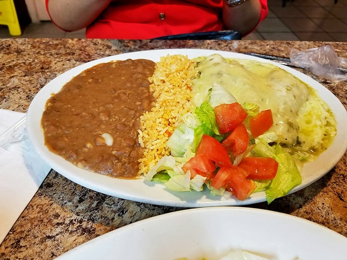 These green enchiladas aren't just covered in sauce&mdash;they're swimming in a verdant pool that makes you wonder why anyone would choose red sauce ever again.