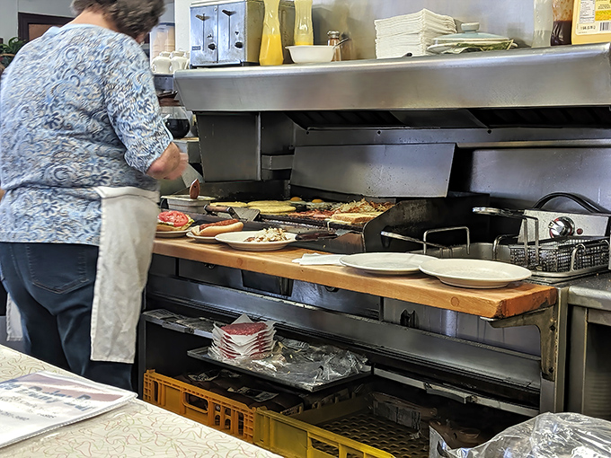 The kitchen ballet&mdash;where short-order magic happens on a grill that's seen more history than most history books.