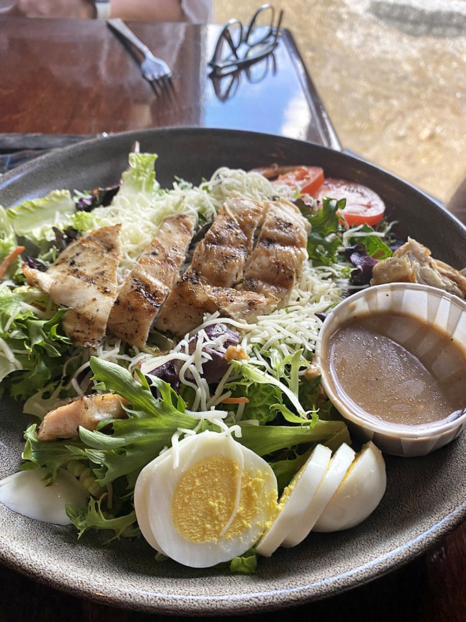 A chicken salad that means business. Those sliced eggs aren't just garnish&mdash;they're a promise that this plate understands proper protein distribution.