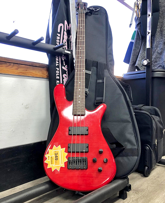 Some aspiring rock star's abandoned dream awaits its second act. This cherry-red bass guitar might just be your ticket to garage band glory.