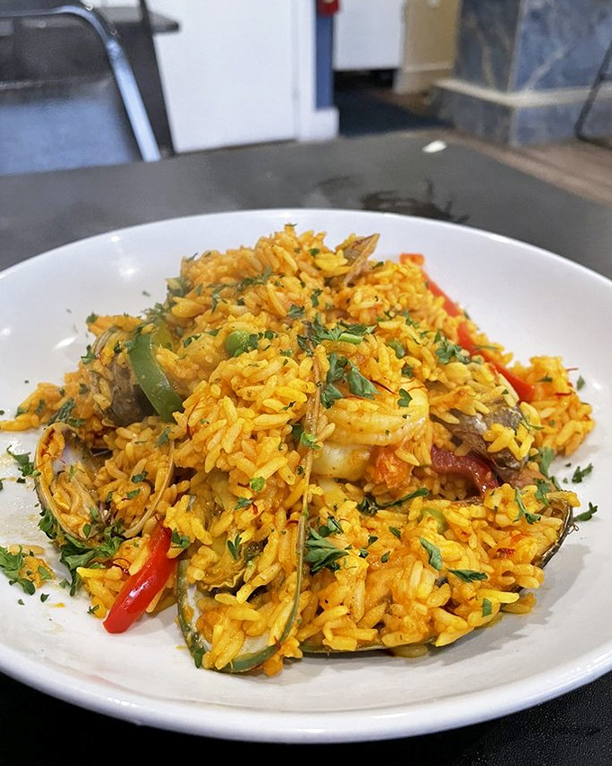 Their paella&mdash;a sunset-colored masterpiece where saffron rice plays host to a seafood reunion that would make Neptune himself request seconds.