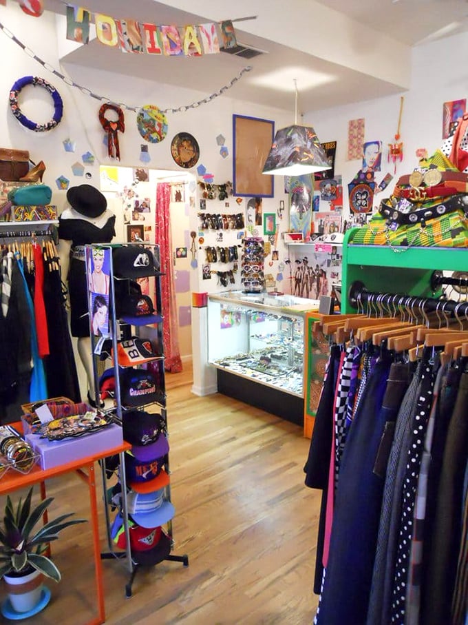 A colorful "HOMINAME" banner presides over this corner of carefully curated chaos. The jewelry case gleams with treasures your mother told you not to buy.