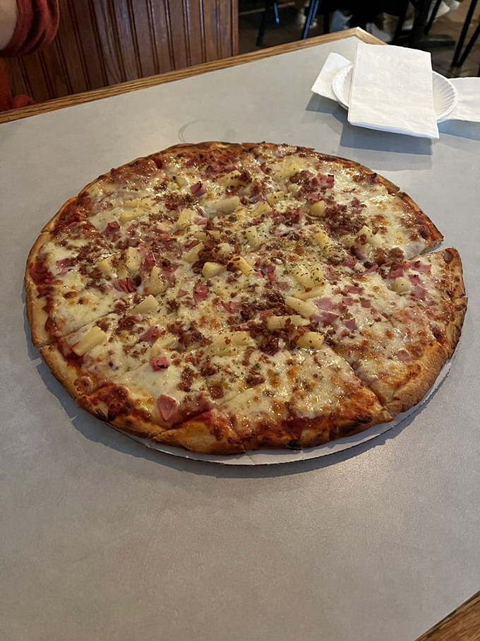 Hawaiian pizza that could convert even the most ardent pineapple skeptics. Sweet, savory, and seriously addictive&mdash;island vibes in the heart of Ohio.