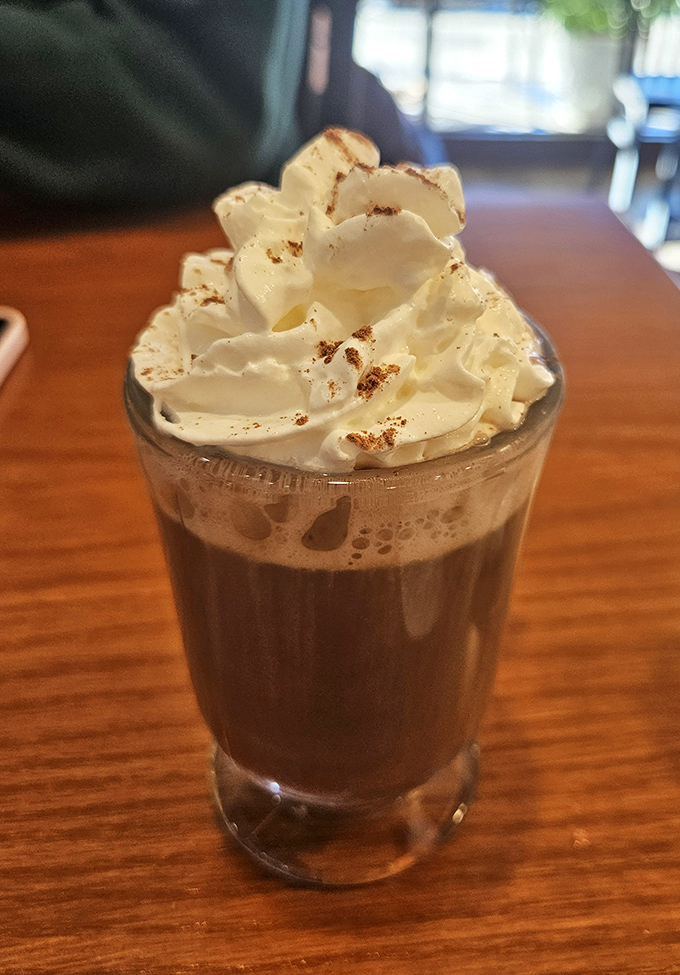 Hot chocolate topped with a cloud of whipped cream&mdash;proof that sometimes the simplest pleasures are the ones we return to again and again.