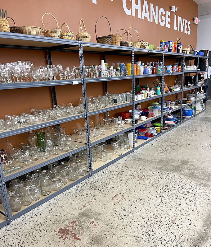 "CHANGE LIVES" isn't just wall decor&mdash;it's the mission. Every glass, basket, and mug purchased helps fund community programs that transform Greenville.