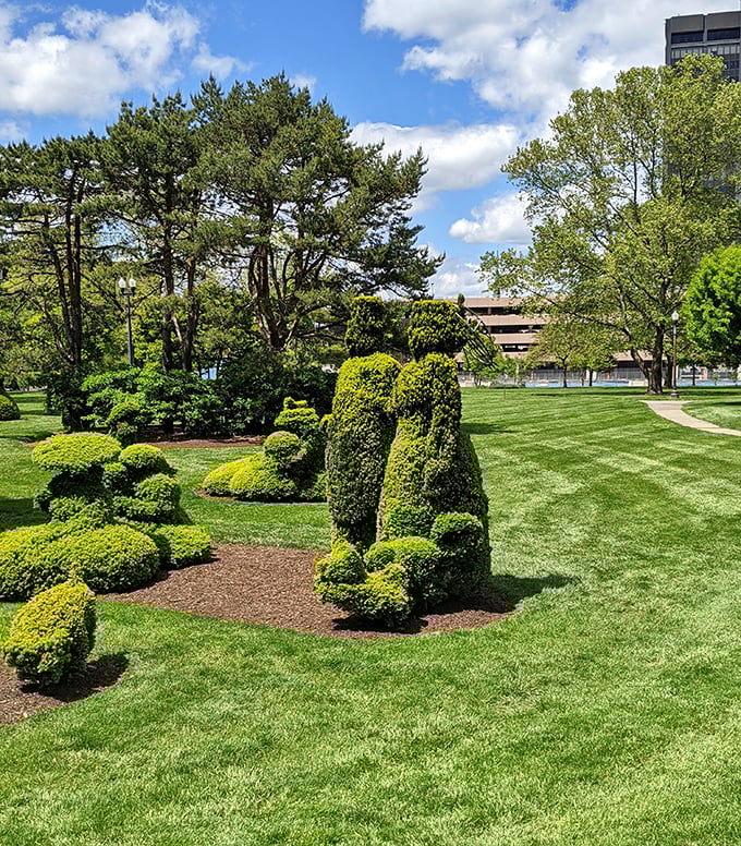 "Pardon me, but your hat is absolutely fabulous!" These topiary figures stand frozen in eternal conversation, waiting for you to join in.