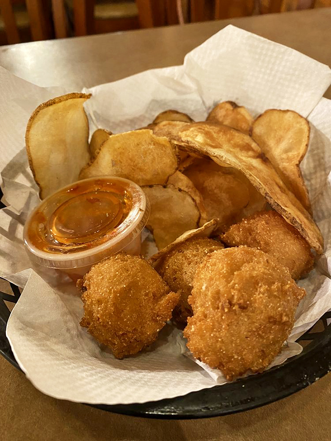 Hush puppies and homemade chips &ndash; the supporting actors that deserve their own spin-off show. Crispy, comforting carbs that make every bite of trout even better.