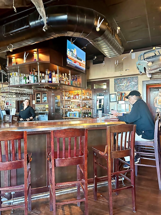 The bar beckons with bottles lined up like soldiers ready for duty, promising libations that complement rather than compete with seafood's delicate flavors.