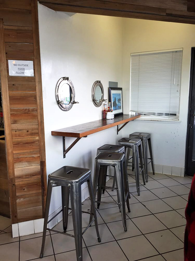 The indoor seating area offers porthole windows because they understand: when eating seafood this good, you should feel slightly nautical.