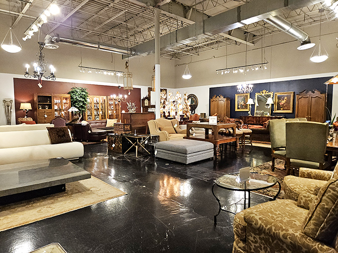 The showroom stretches into infinity, a wonderland where contemporary sofas mingle with antique tables like the world's most interesting cocktail party.