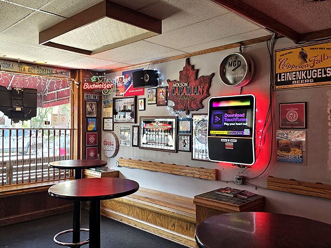 Every inch of wall space tells a story at Thurman's. The neon glow and decades of memorabilia create the perfect backdrop for burger-based decision making.