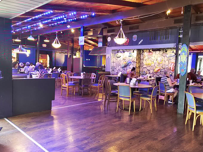 Blue lighting and rustic wood create an underwater grotto vibe&mdash;minus the need for scuba gear while you eat.