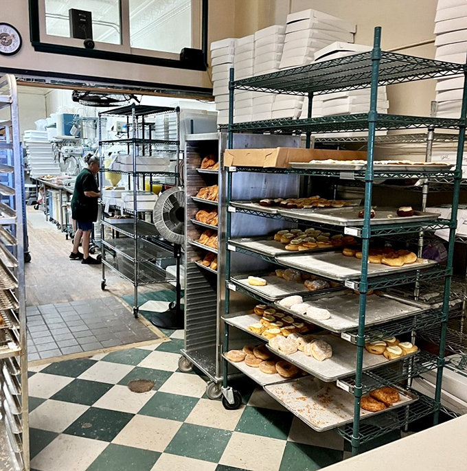 Behind the scenes at Oram's, where racks of freshly made donuts await their moment of glory in the display case.