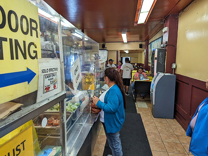 The narrow corridor to burrito heaven&mdash;where patience is rewarded and indecision at the counter is punishable by stern looks.
