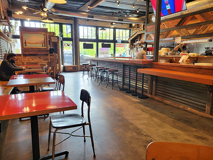 The open layout invites you to watch the chicken magic happen. Industrial meets homey in this space where serious food doesn't take itself too seriously.