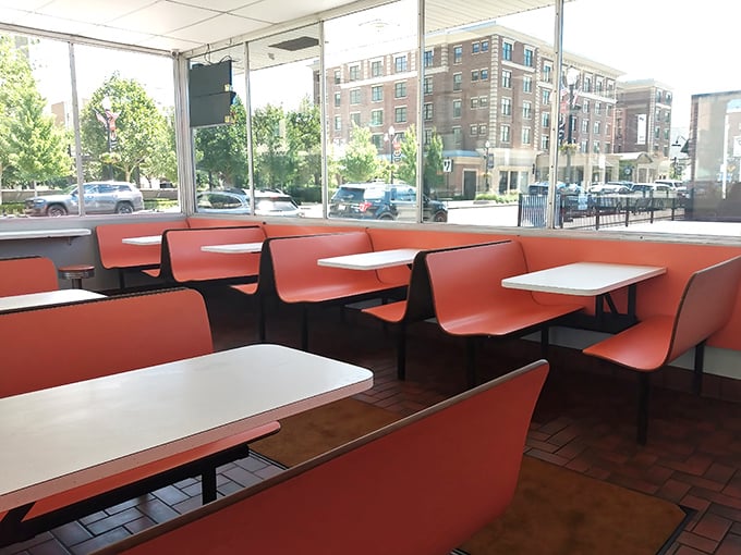 The dining area's coral-colored booths offer front-row seats to downtown Findlay. These tables have hosted first dates, business deals, and generations of family gatherings.