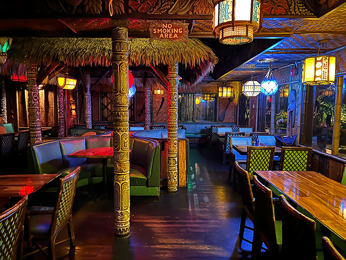 Carved tiki columns stand sentinel in this dining room where every detail transports you further from Florida and closer to fantasy.